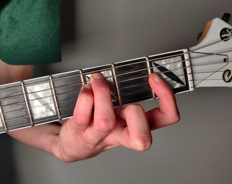 5 Easy Ways to Play an F Minor Chord on Guitar - Beast Mode Guitar