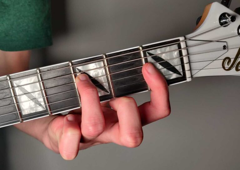 5 Easy Ways to Play an F Minor Chord on Guitar - Beast Mode Guitar